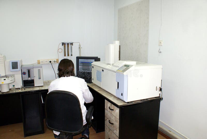 A Laboratory Technician is Performing Chemical Analysis in a Laboratory ...