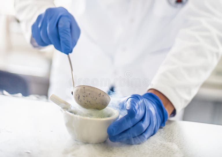 Laboratory Technician Performs an Experiment with Liquid Nitrogen Stock ...