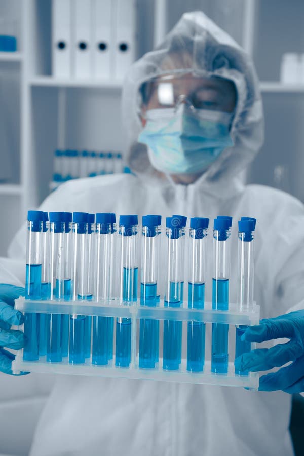 A Laboratory Technician Skillfully Analyzing a Variety of Test Tubes ...