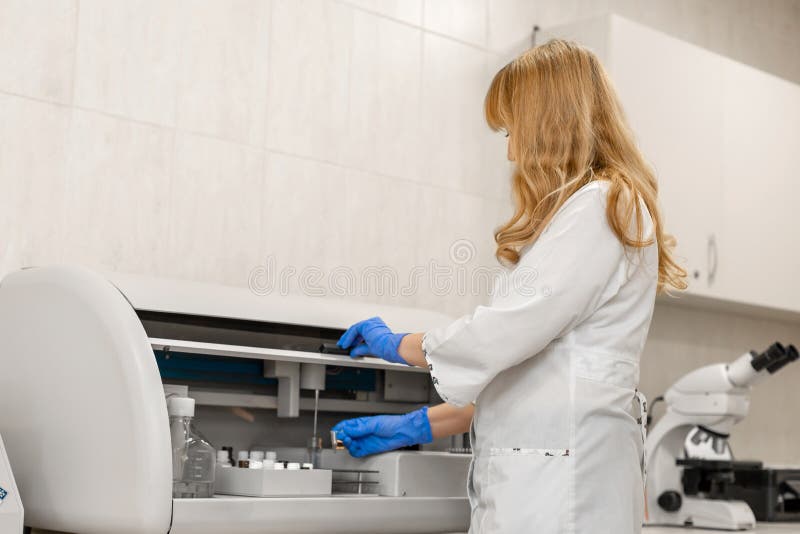 Laboratory Technician Test Blood in Automatic Blood Sample Analyzer ...