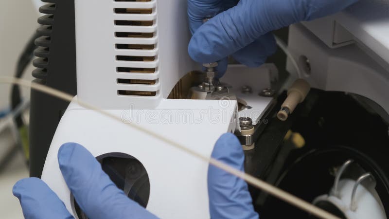Laboratory Technician Unscrews the Capillary into the Nebulizer Needle ...
