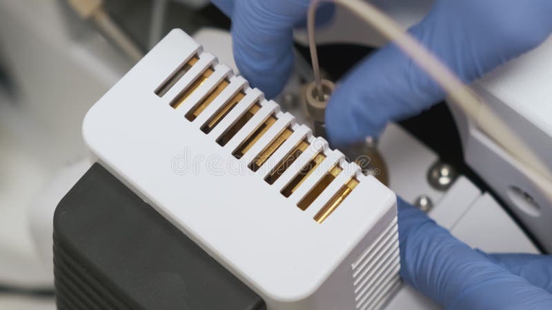 Laboratory Technician Unscrews the Capillary into the Nebulizer Needle ...