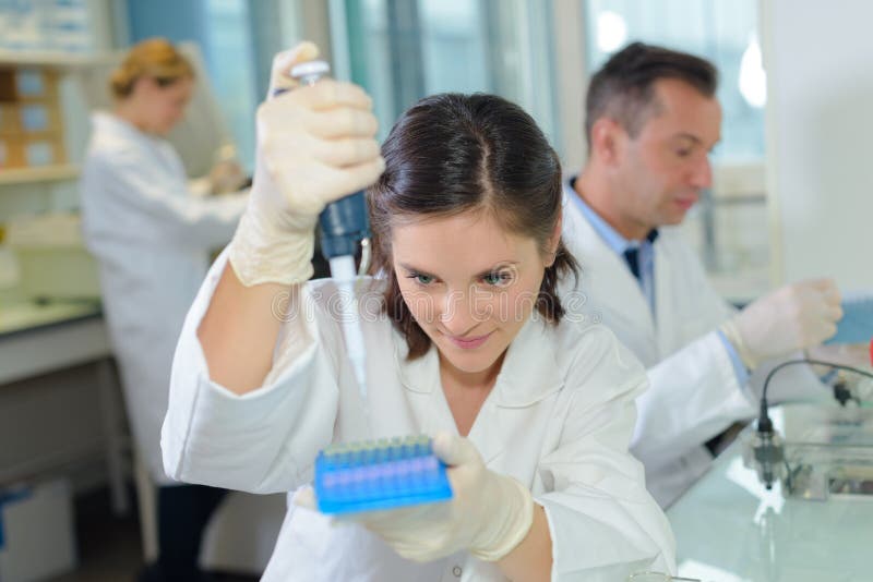 Laboratory Technician Using Pipette Stock Photo - Image of analysis ...