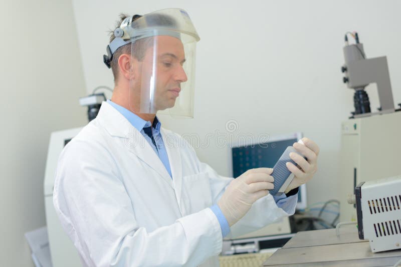 Laboratory Technician Working Behind Visor Stock Photo - Image of ...