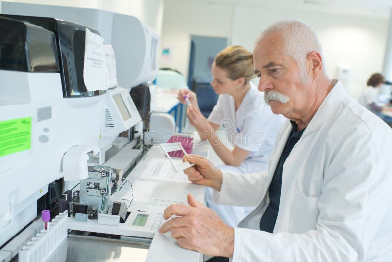 Laboratory Technicians at Work Stock Image - Image of blood, doctor ...