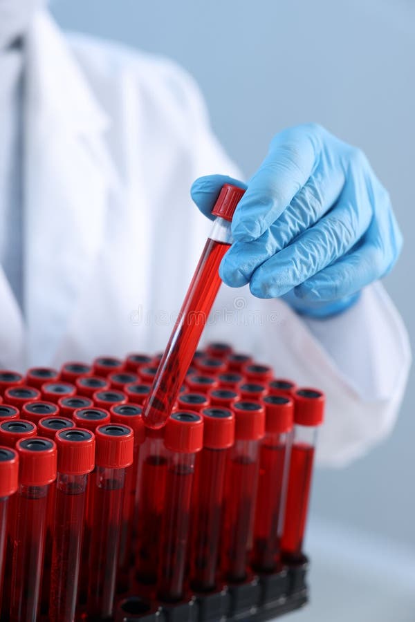 Laboratory Testing. Doctor with Blood Samples in Tubes Indoors, Closeup ...