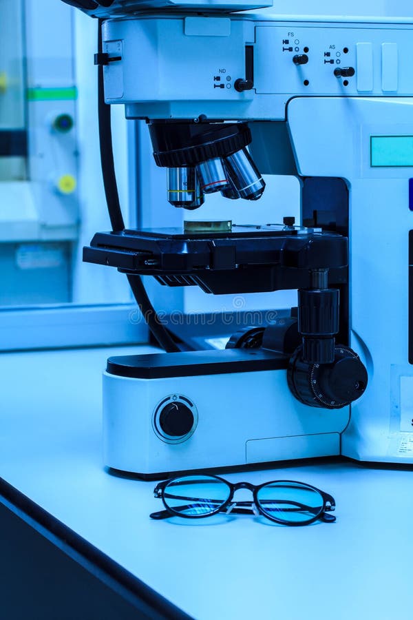 Laboratory Using a Microscope Stock Photo - Image of laboratory ...