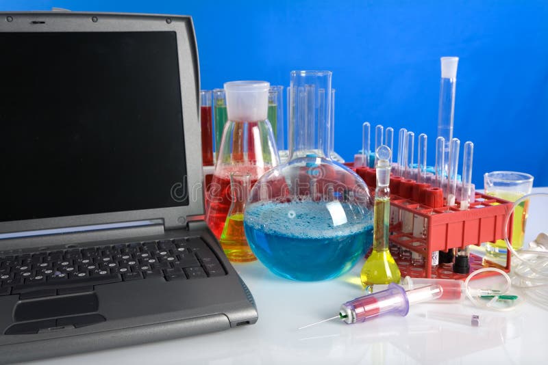 Bunsen Burner Heating Flask with Science Equipment in Laboratory Stock ...