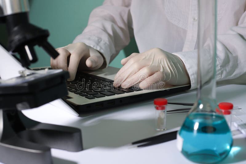 Laboratory. White Table, Hands of a Laboratory Assistant in White ...