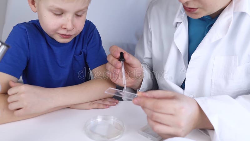 Child Chemist. Teacher Shows a Visual Experiment. a Science Mentor ...