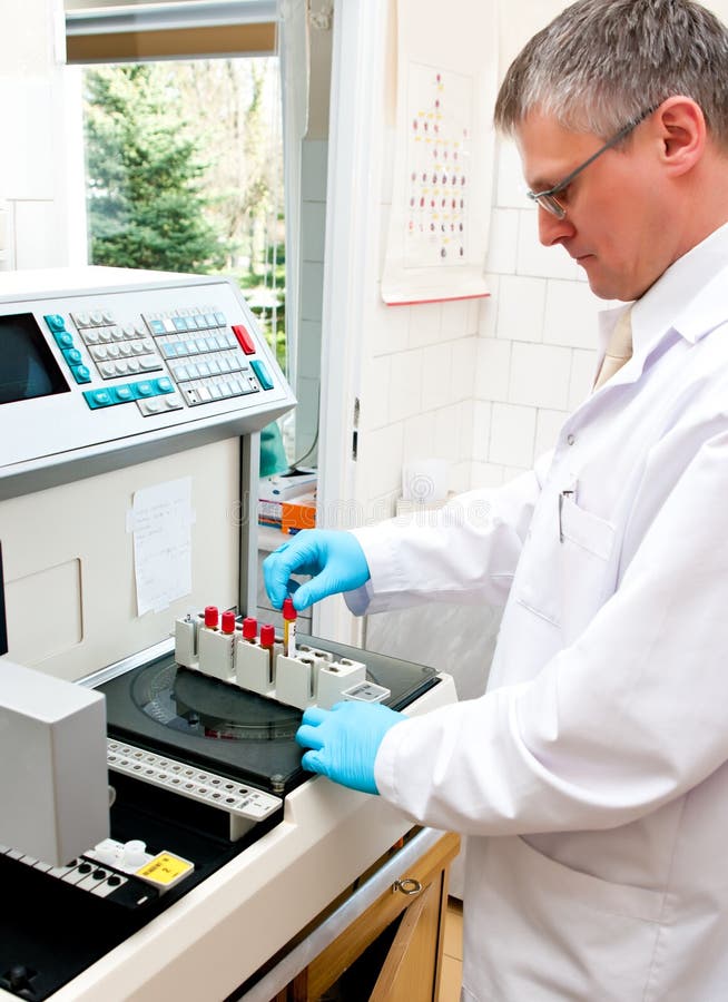 Laboratory man and machine stock photo. Image of instrument - 2333510