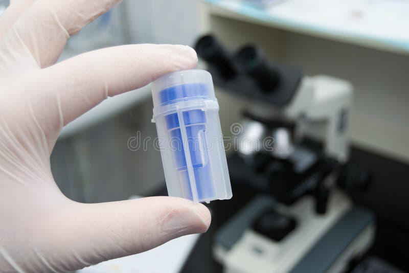 Laboratory Worker Holding in His Hand a Bottle for Feces Samples Stock ...