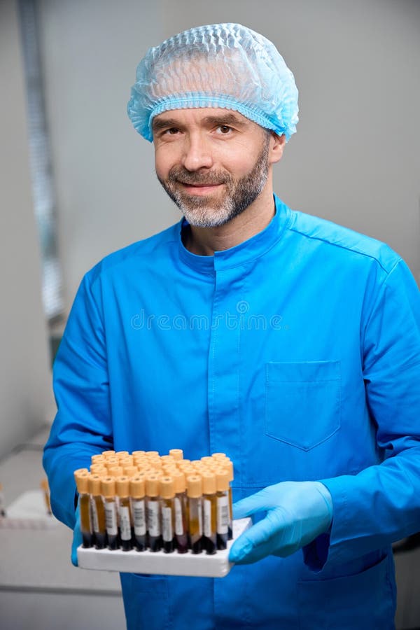 Laboratory Worker Holds Set with Biomaterial for Blood Analysis in His ...