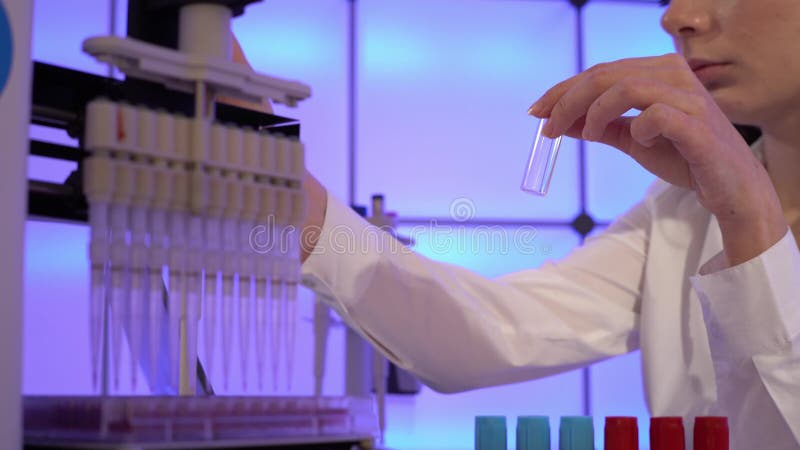 Laboratory Worker Matches Color with Test Indicator Paper Stock Video ...