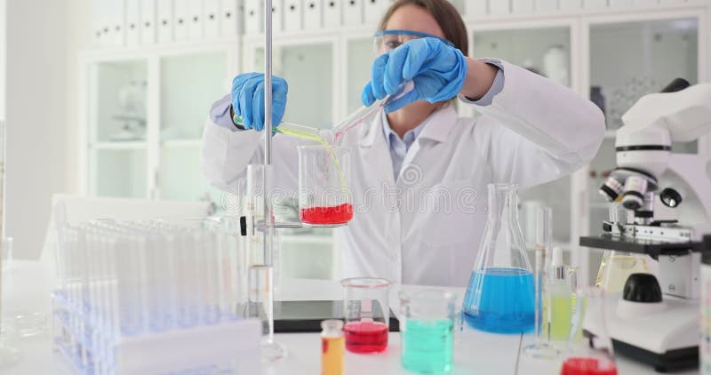 Laboratory Worker Pours Reagent into Beaker from Test Tubes Stock ...