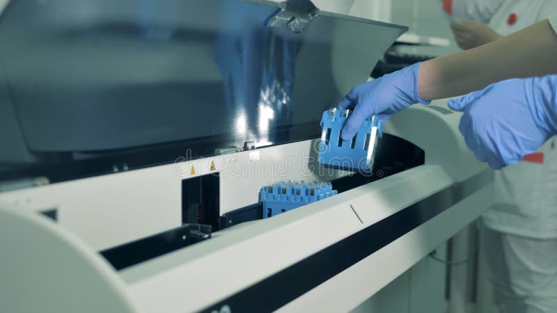 Laboratory Worker Puts Samples into Testing Machine. Stock Footage ...