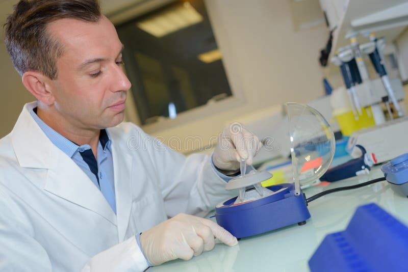 Laboratory Worker Using Equipment Stock Photo - Image of cure ...