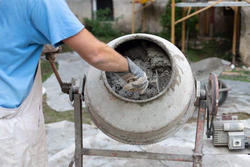 Laborer Worker Operating Concrete Cement Mixer at Construction Site ...