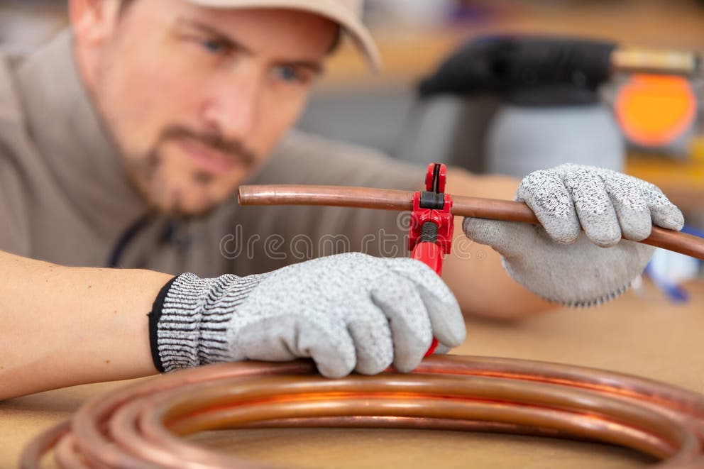 Laborer Cutting Copper Pipe in Workshop Stock Image - Image of ...