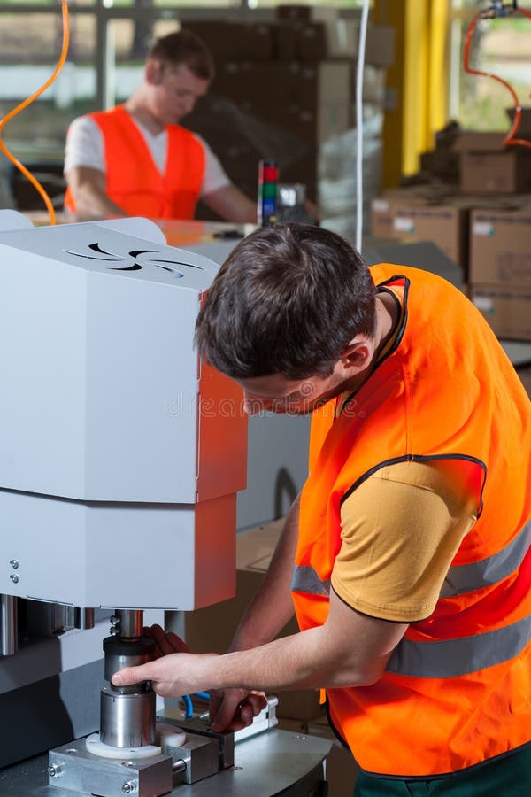 Machine operator at work stock image. Image of manufacturing - 41548721