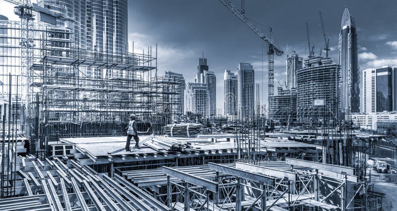 Laborers Working on Modern Constraction Site Works in Dubai. Fast Urban ...