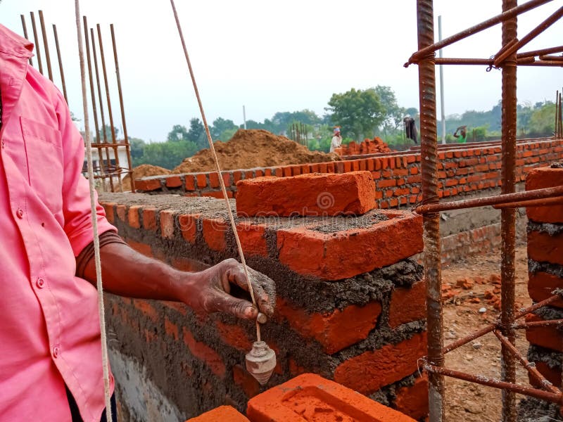Labour Hand Taking Wall Measurements during Construction Work at Site ...