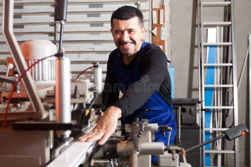 Labour Mature Working on Lathe Machine at Factory Stock Photo - Image ...