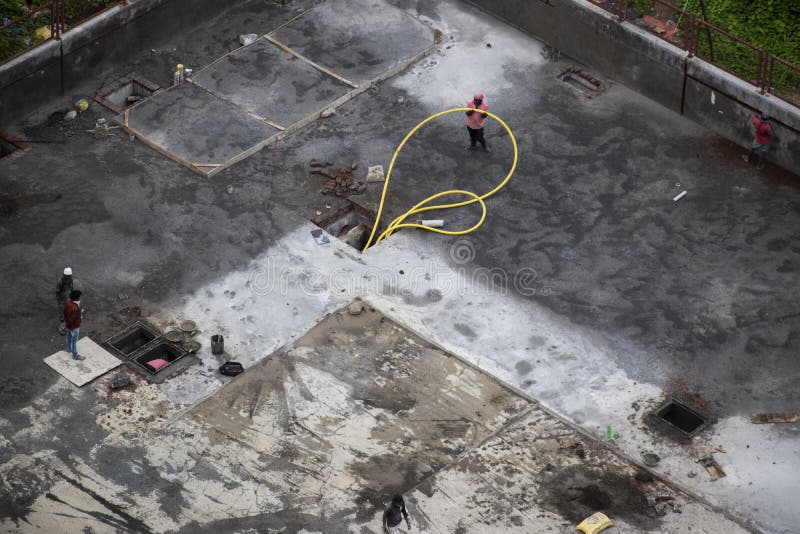 Labour Worker Inserting Drainage and Electrical Pipe in Inspection ...