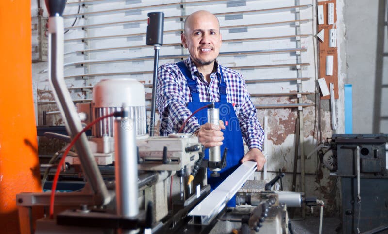 Labour Working in Uniform on Lathe Machine at Factory Stock Image ...