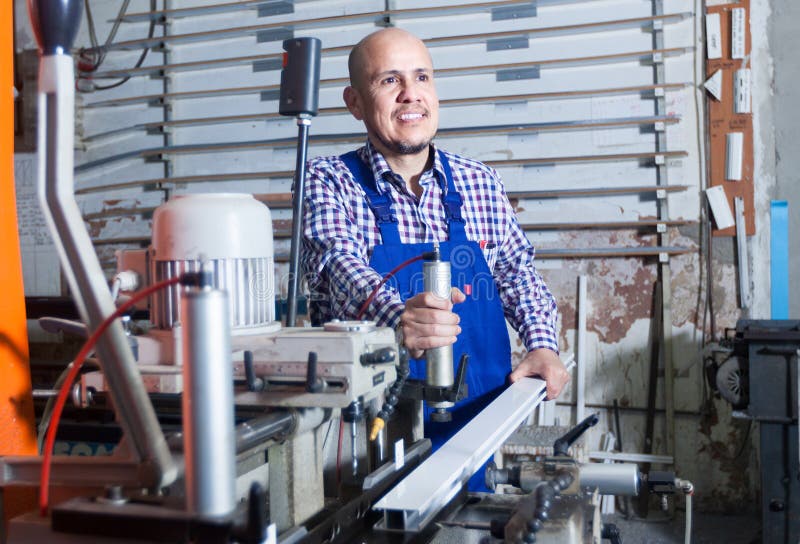 Labour Working in Uniform on Lathe Machine at Factory Stock Photo ...