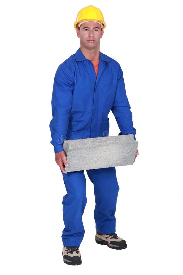 Labourer lifting a block stock photo. Image of grump - 37037892