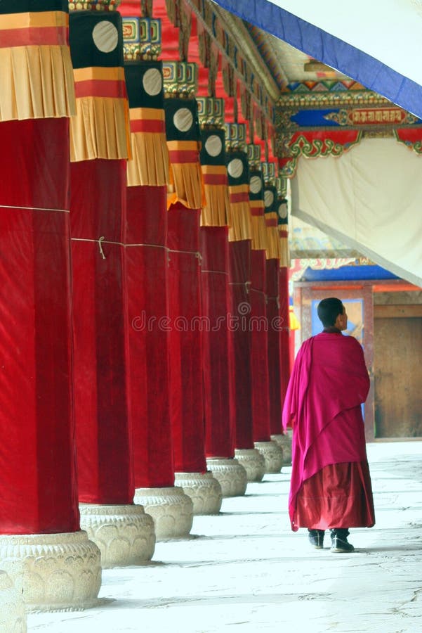 Monk Walking in Gallery with Red Pilars, Labrang Monastery, Xiahe, West ...