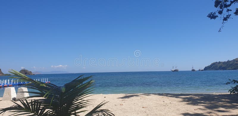 White Sand, Blue Sky and Sea, Labuan Bajo Beach Stock Image - Image of ...