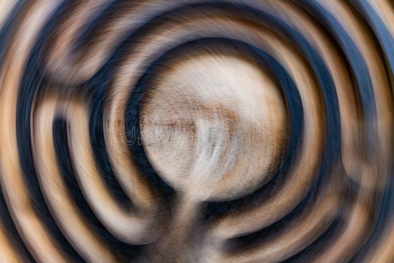 A Labyrinth of Circular Blurred Black Lines on Brown Surface. Stock ...