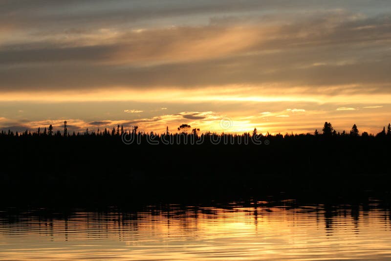 Lac Seul at sunset stock photo. Image of shore, silhouette - 5838984