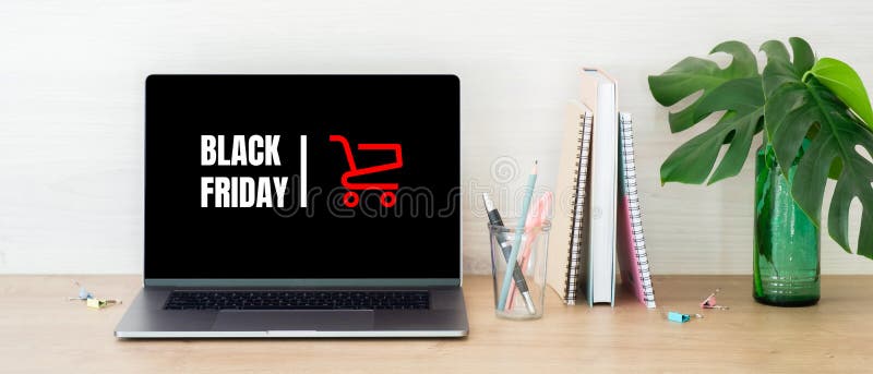 Lack Friday Advertisement in a Laptop Computer Screen Placed on a Women ...