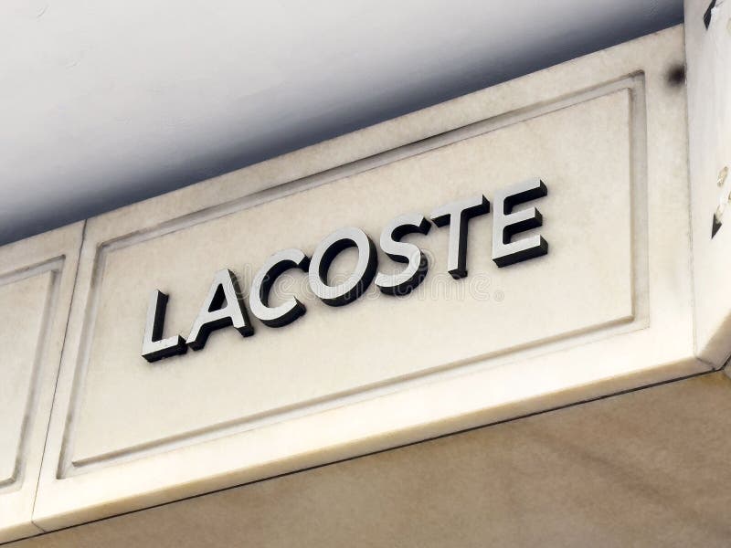 Lacoste Storefront Signage on Beige Building Wall Editorial Image ...