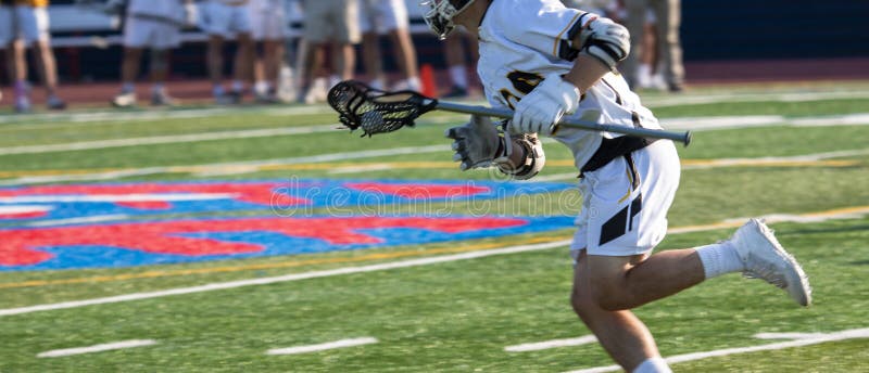 Lacrosse Player Running Down the Field with the Ball Stock Photo ...