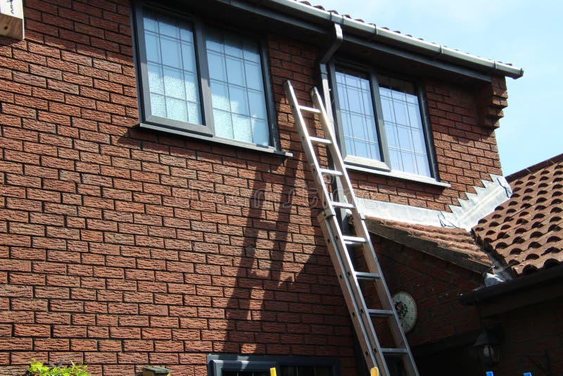 Ladder against the wall stock photo. Image of leaning - 229704110