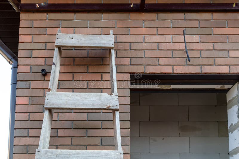 Ladder on a Brick Wall at a House Stock Image - Image of damaged, home ...