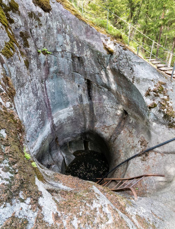 Ladder in a deep pothole stock photo. Image of ladder - 55533036
