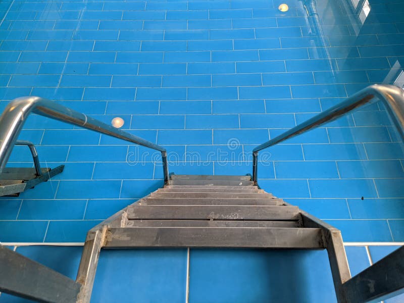 Ladder Leading into the Water of a Pool Stock Image - Image of beach ...