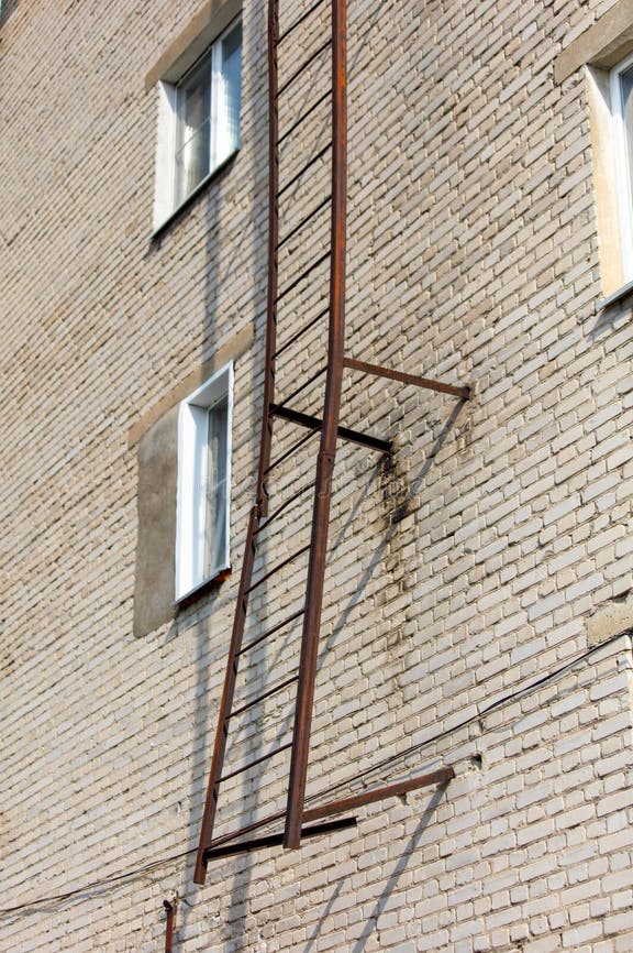 A Ladder is Leaning Against a Brick Wall Stock Photo - Image of vintage ...