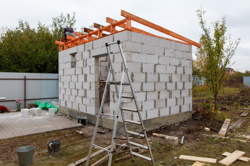 A Ladder is Leaning Against a Building Under Construction Stock Photo ...