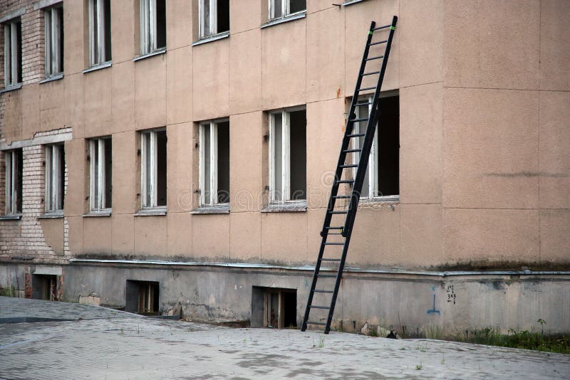 Ladder Near Building with Broken Windows Stock Image - Image of ...