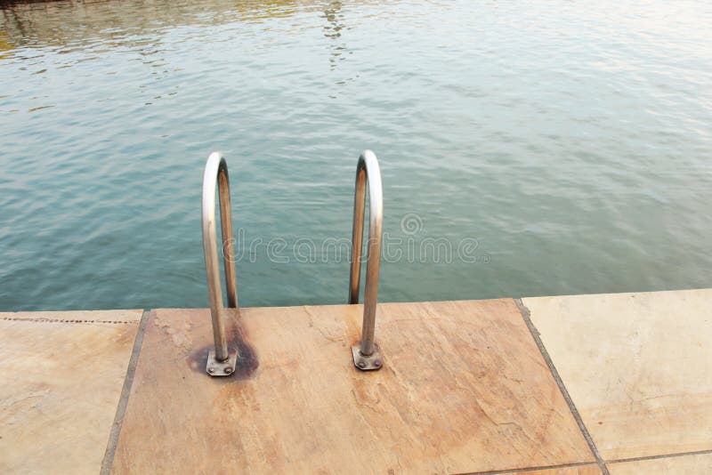 Ladder into swimming pool stock image. Image of house - 11388451