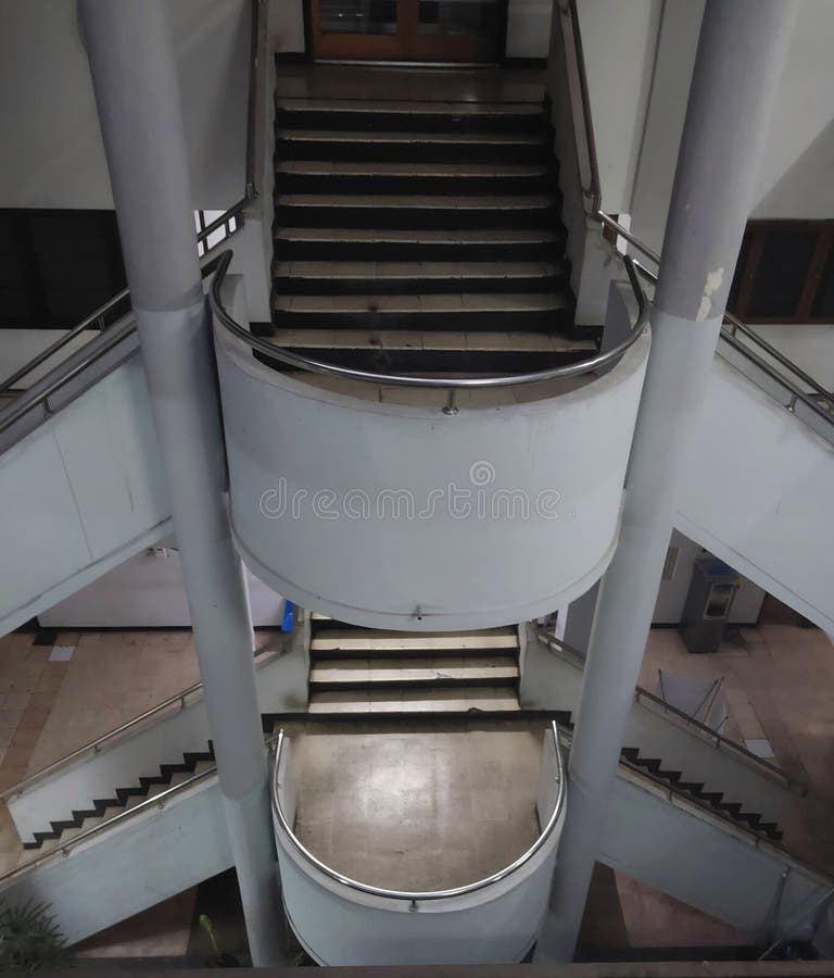 A Ladder To Pass through Several Floors in a Building Stock Photo ...