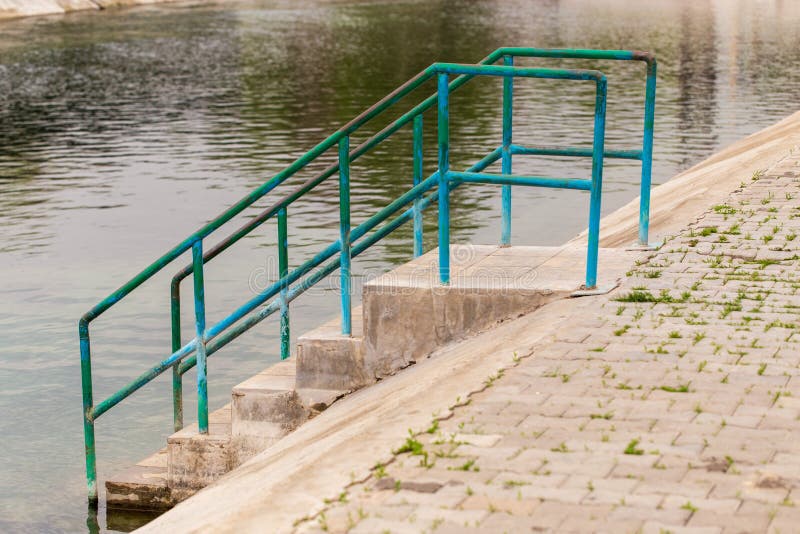 Ladder to a pond in nature stock image. Image of resort - 140627647