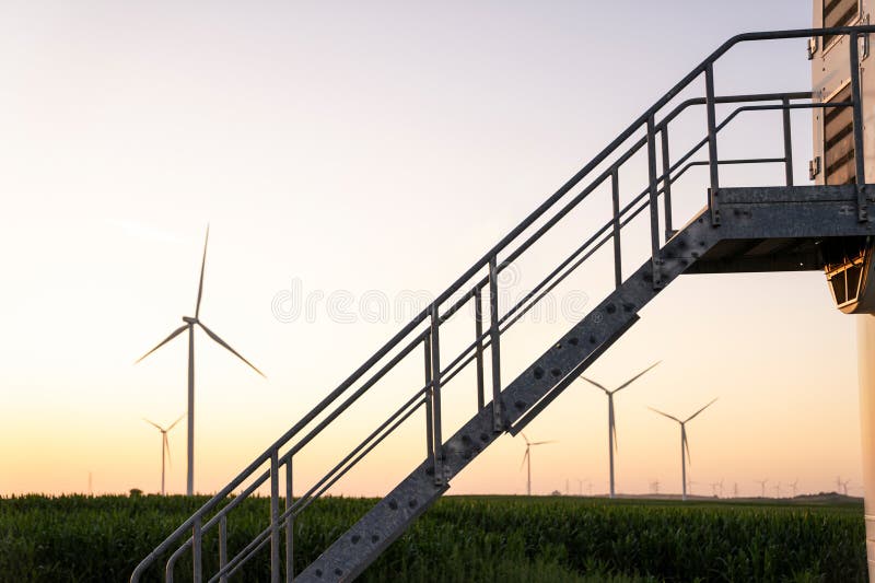 Ladder at the Wind Generator. Wind Turbines at Sunset Stock Photo ...