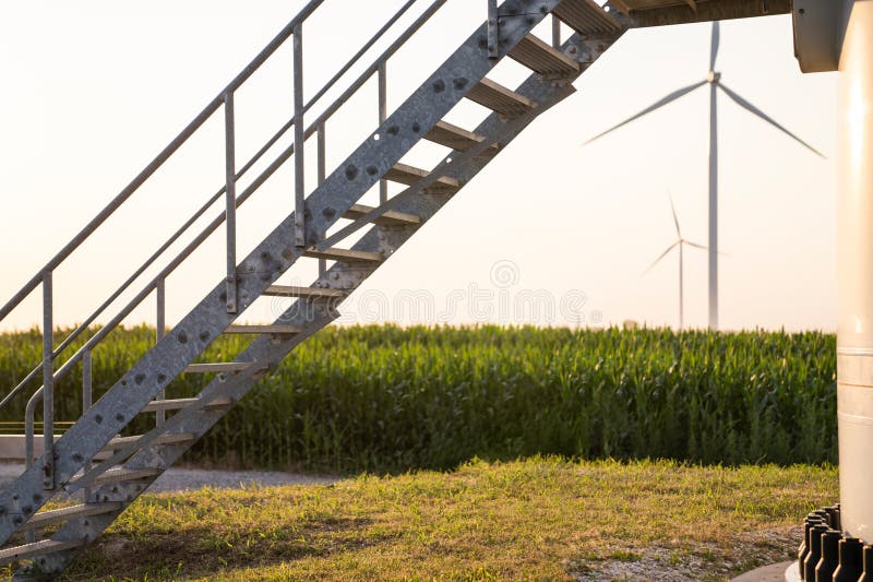 Ladder at the Wind Generator. Wind Turbines at Sunset Stock Photo ...